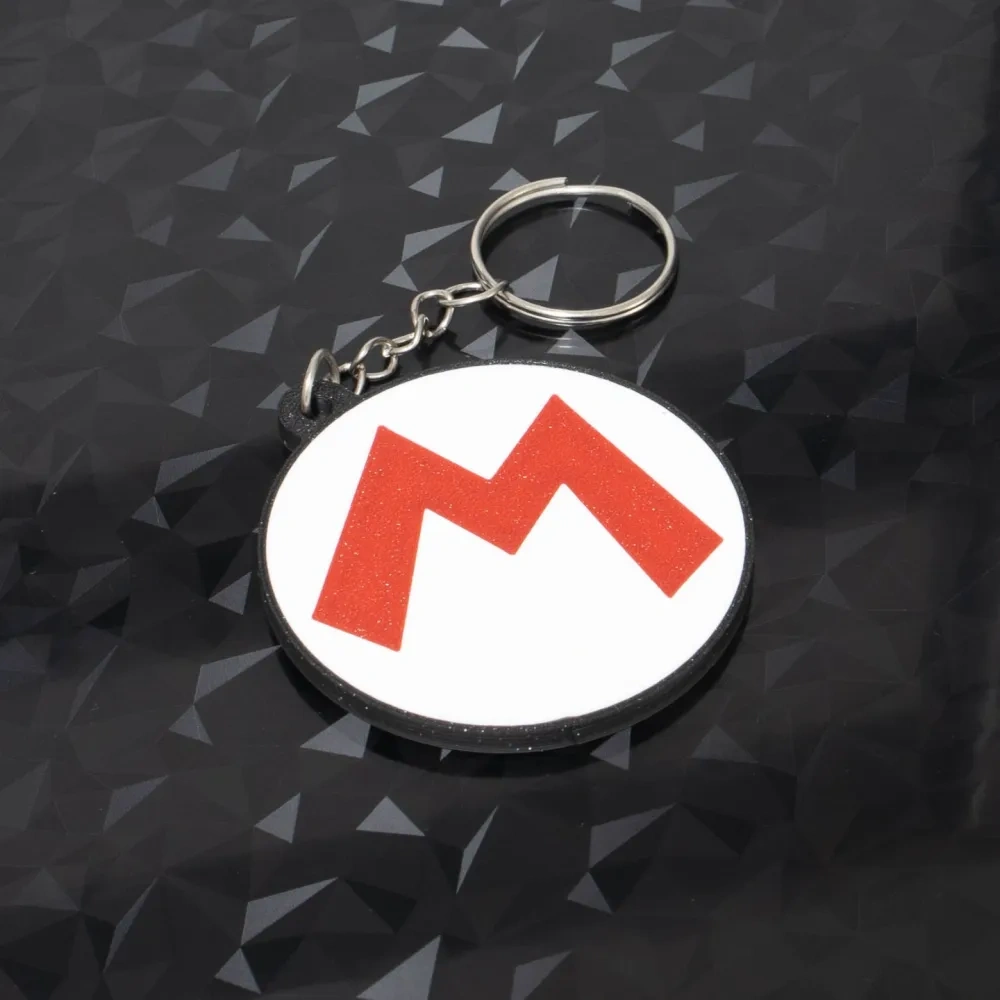 马里奥兄弟钥匙扣徽标 M - 免费 3D 打印模型 - MakerWorld
